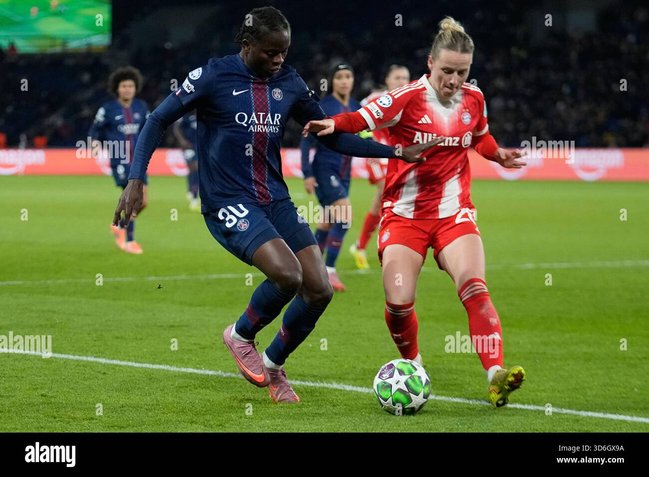 PSG's Merveille Kanjinga, left and Bayern's Franziska Kett fight for ...