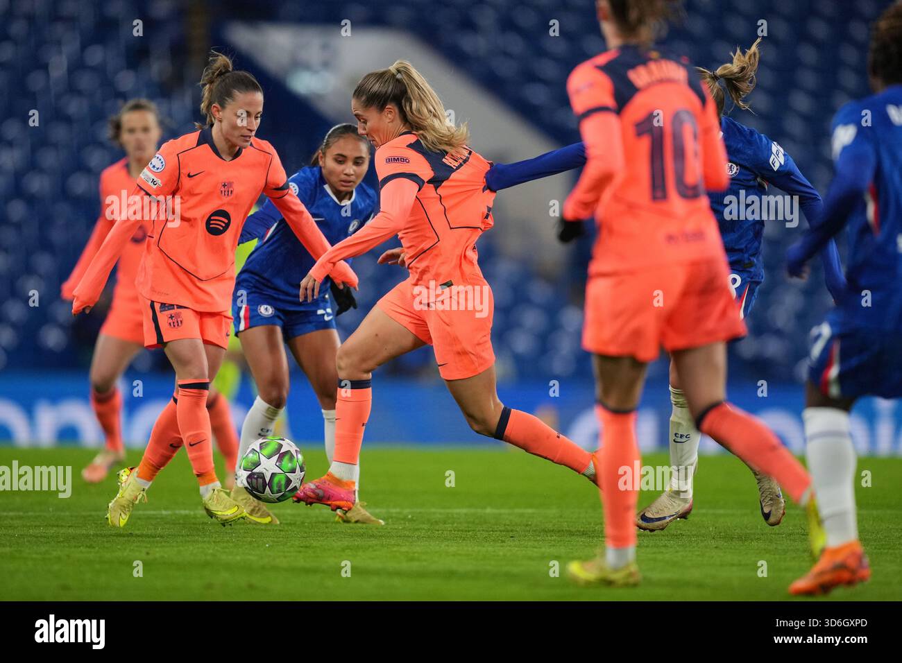 Barcelona's Laia Aleixandri runs with the ball while Chelsea's Wieke ...