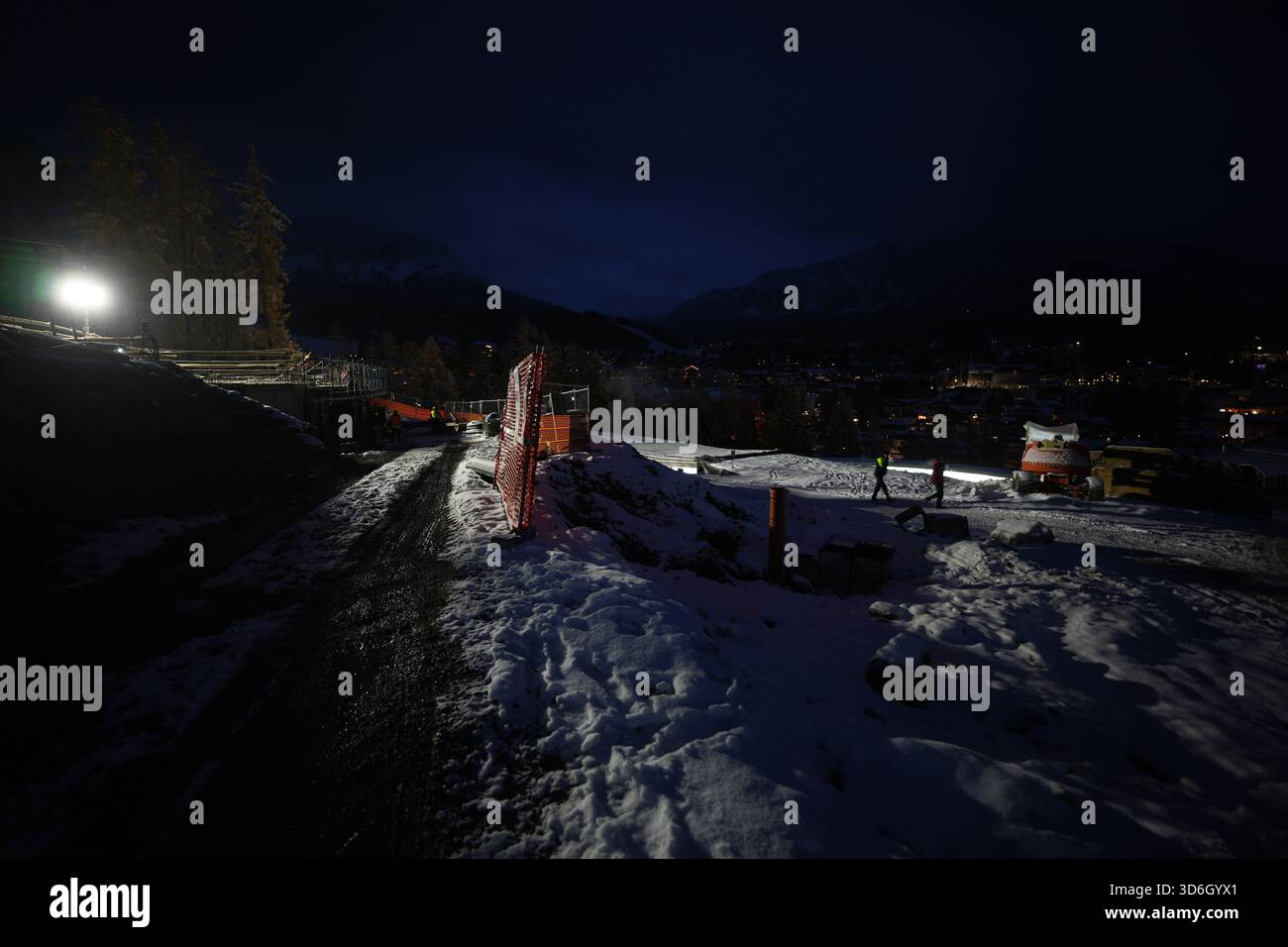 Workers operate around the track during a training session ahead of a ...