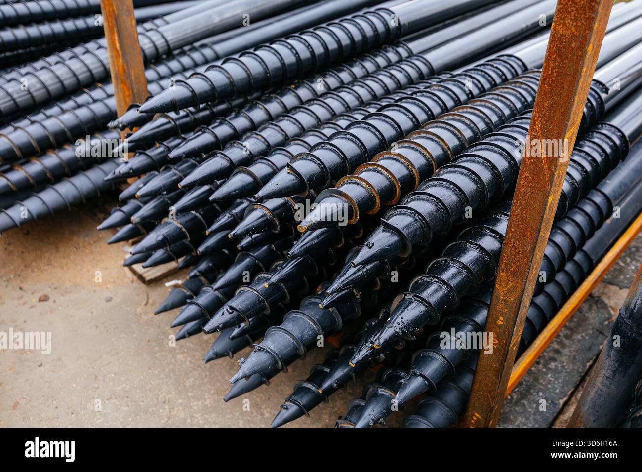 Stack of screw piles for house foundation Stock Photo - Alamy