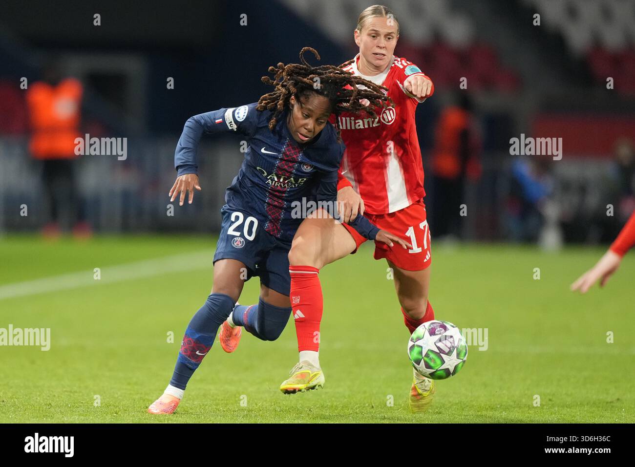 PSG's Tara Elimbi Gilbert, left, and Bayern's Klara Buhl foght for the ...
