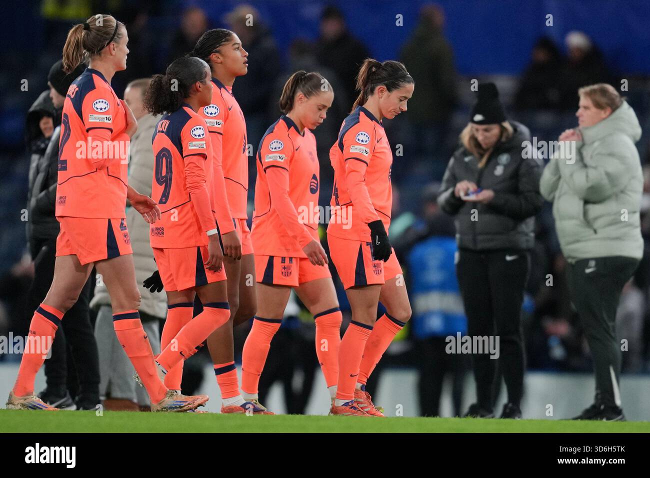 Barcelona's Aitana Bonmati, right, and her teammates leave the pitch at ...