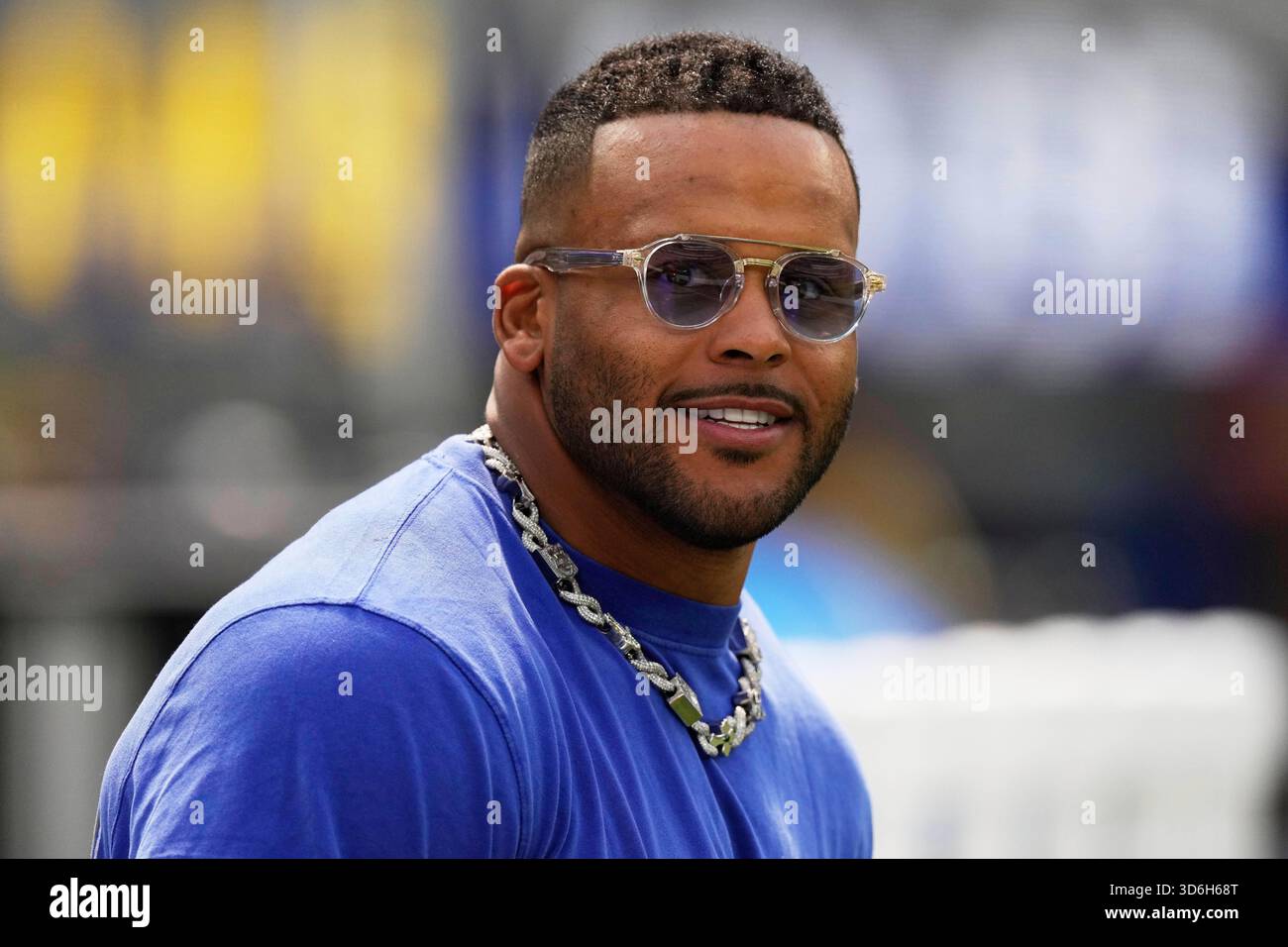 FILE - Former Los Angeles Rams player Aaron Donald watches players warm ...