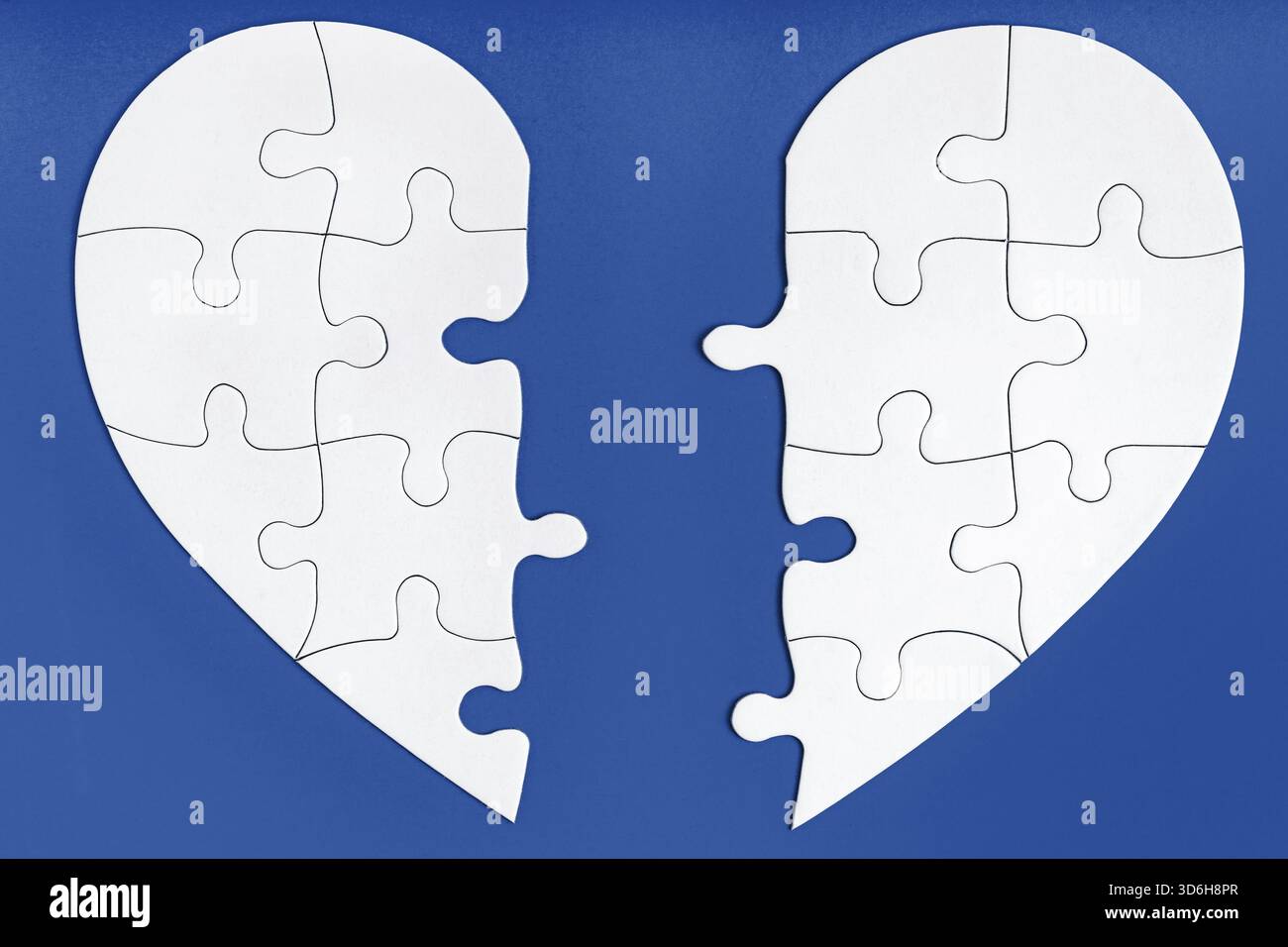 Two matching halves of one heart on trendy blue. Care, health, support ...