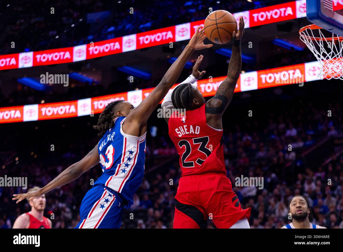 Philadelphia 76ers' Jabari Walker, left, reaches to block the shot by ...