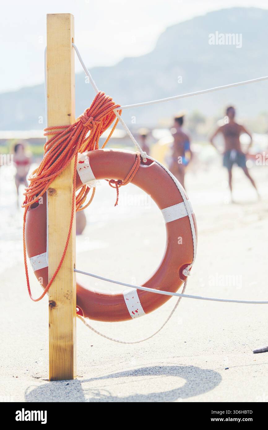 Life saver rescue ring with rope on the beach in case of emergency ...