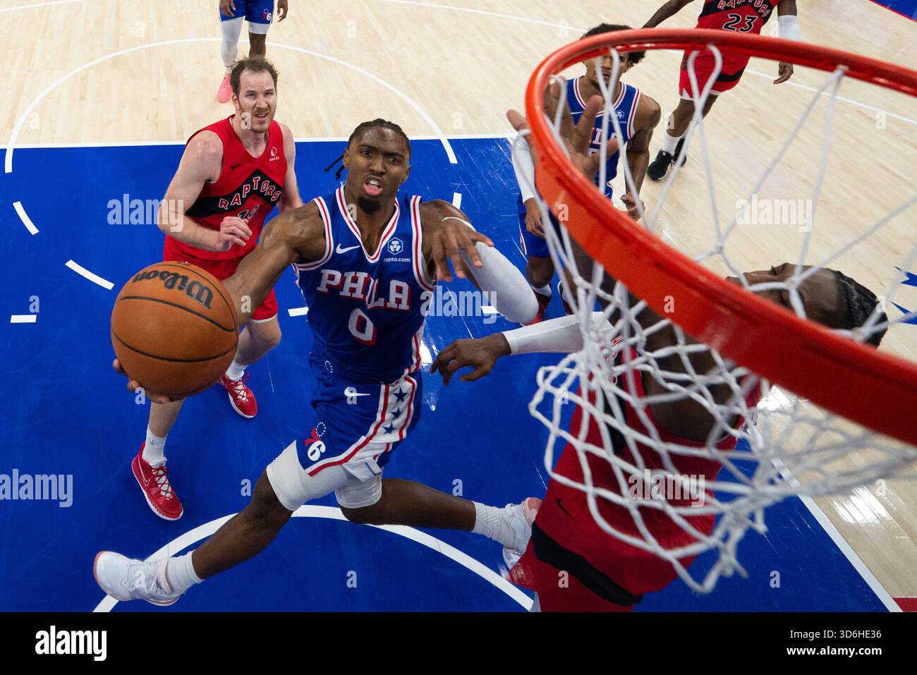Philadelphia 76ers' Tyrese Maxey, left, goes up for the shot against ...