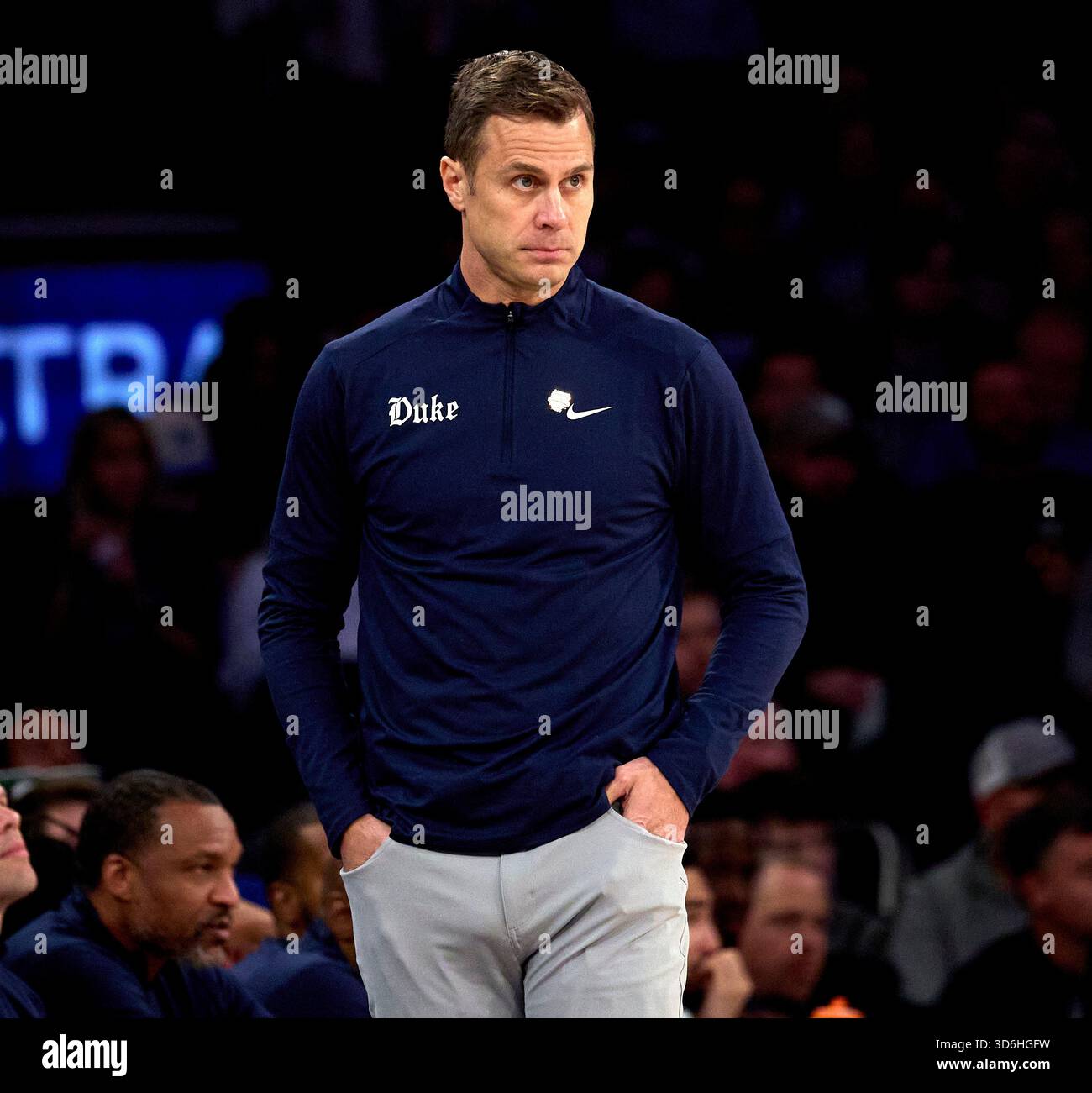Duke Blue Devils head coach Jon Schemer looks at action on the court ...