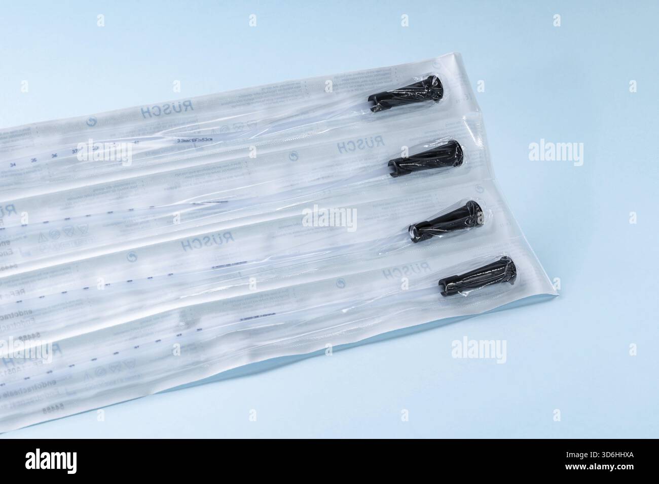 Rusch male and female all purpose catheter on blue background, straight ...