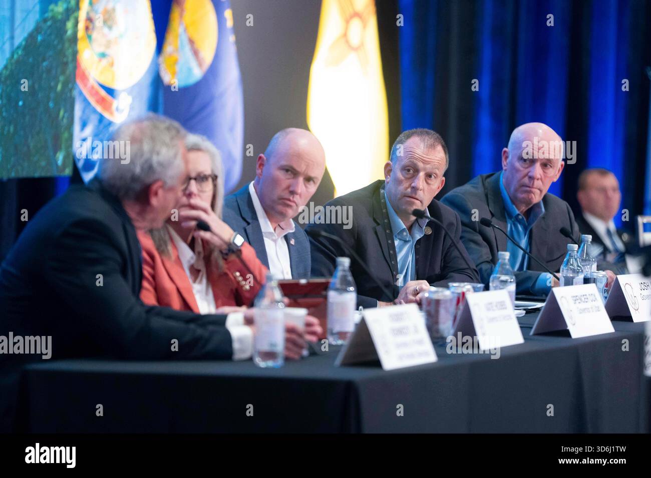 Hawaii Gov. Josh Green, center right, listens to U.S. Secretary of ...