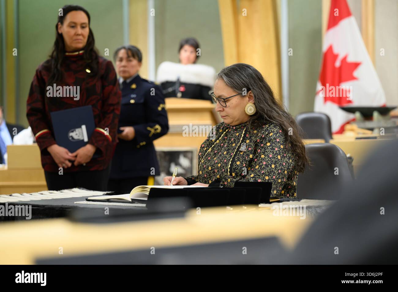 Nunavut Minister of Health, Janet Pitsiulaaq Brewster, signs the oath ...