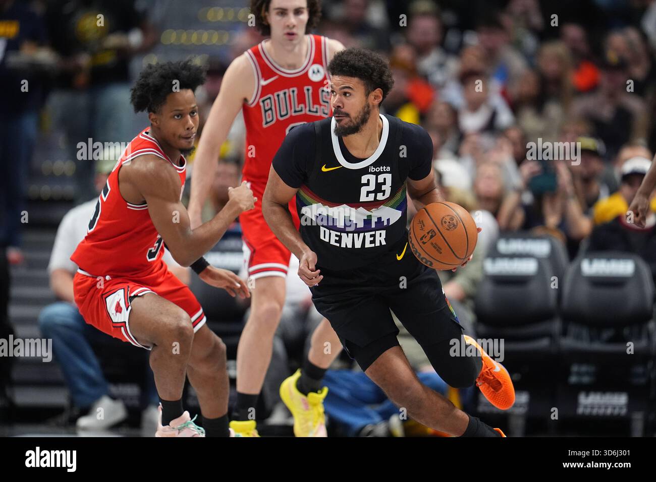 Denver Nuggets forward Cameron Johnson (23) and Chicago Bulls forward ...
