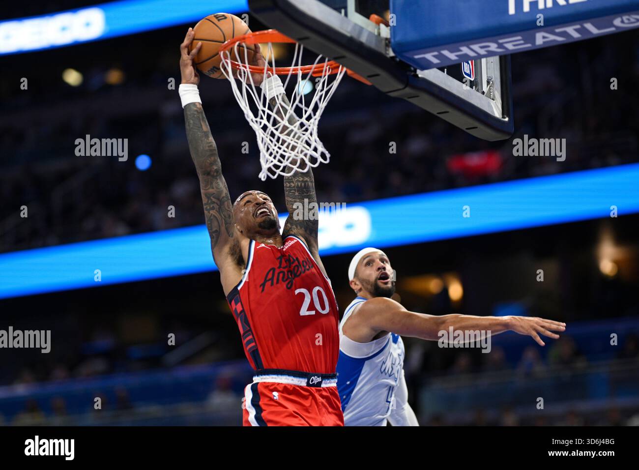Los Angeles Clippers forward John Collins (20) dunks as Orlando Magic ...