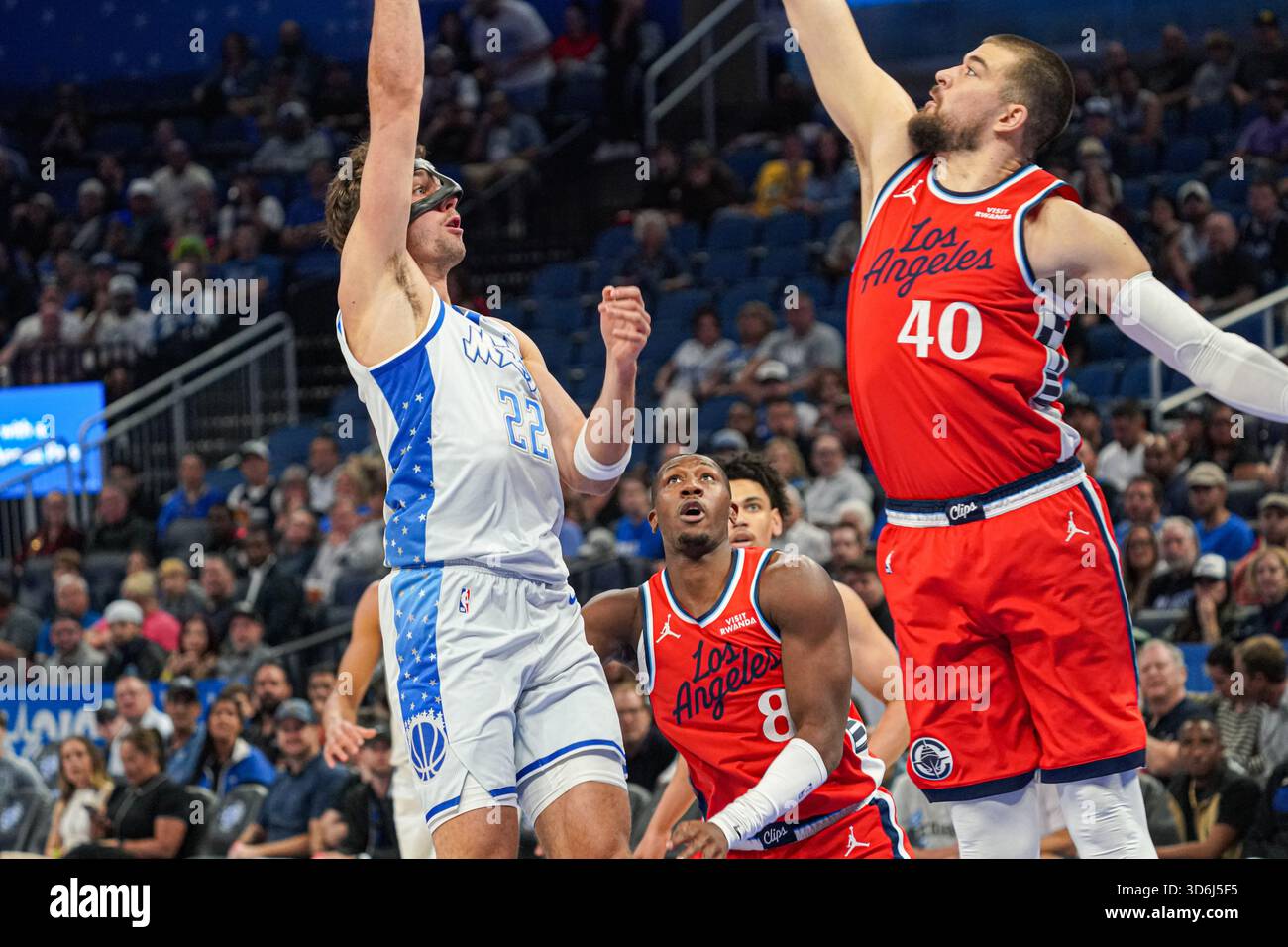 Orlando, Florida, USA, November 20, 2025, Orlando Magic forward Franz Wagner #22 attempt to ...