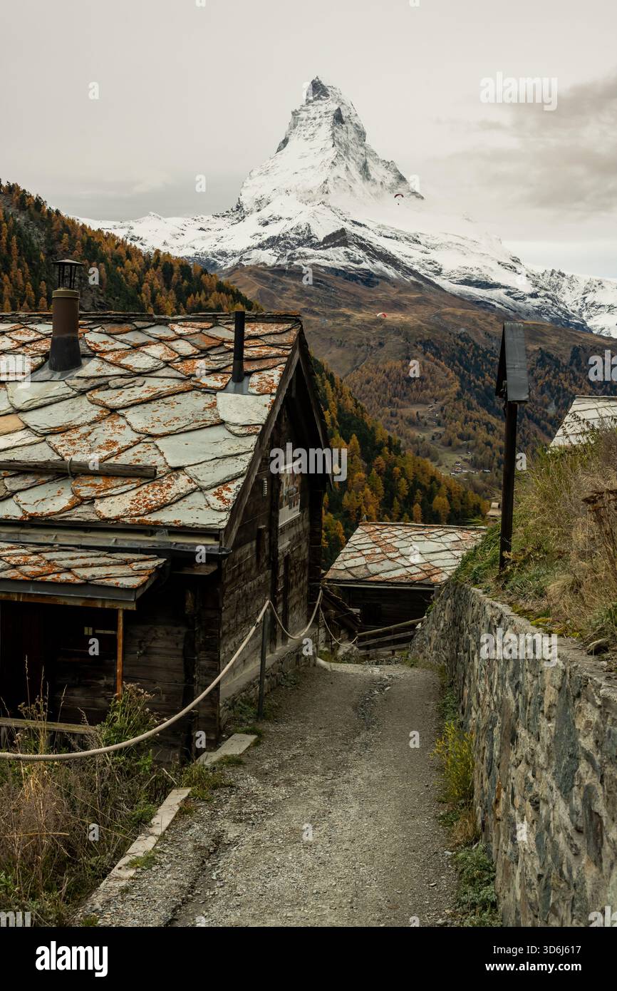 The Matterhorn Looms Over A Small Swiss Village Lane in autumn Stock ...
