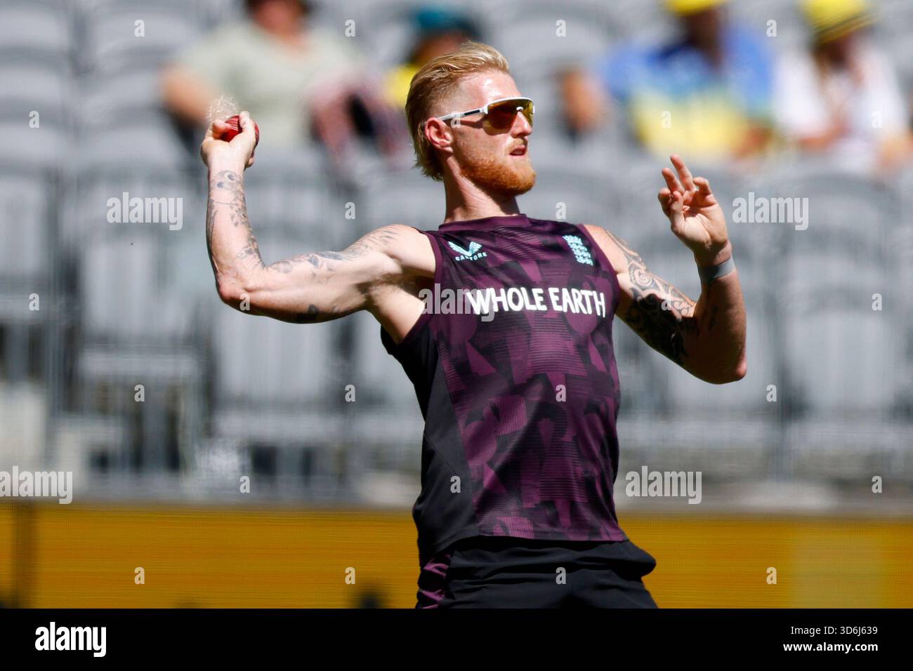 Ben Stokes of England practices his catching as he warms up during day ...