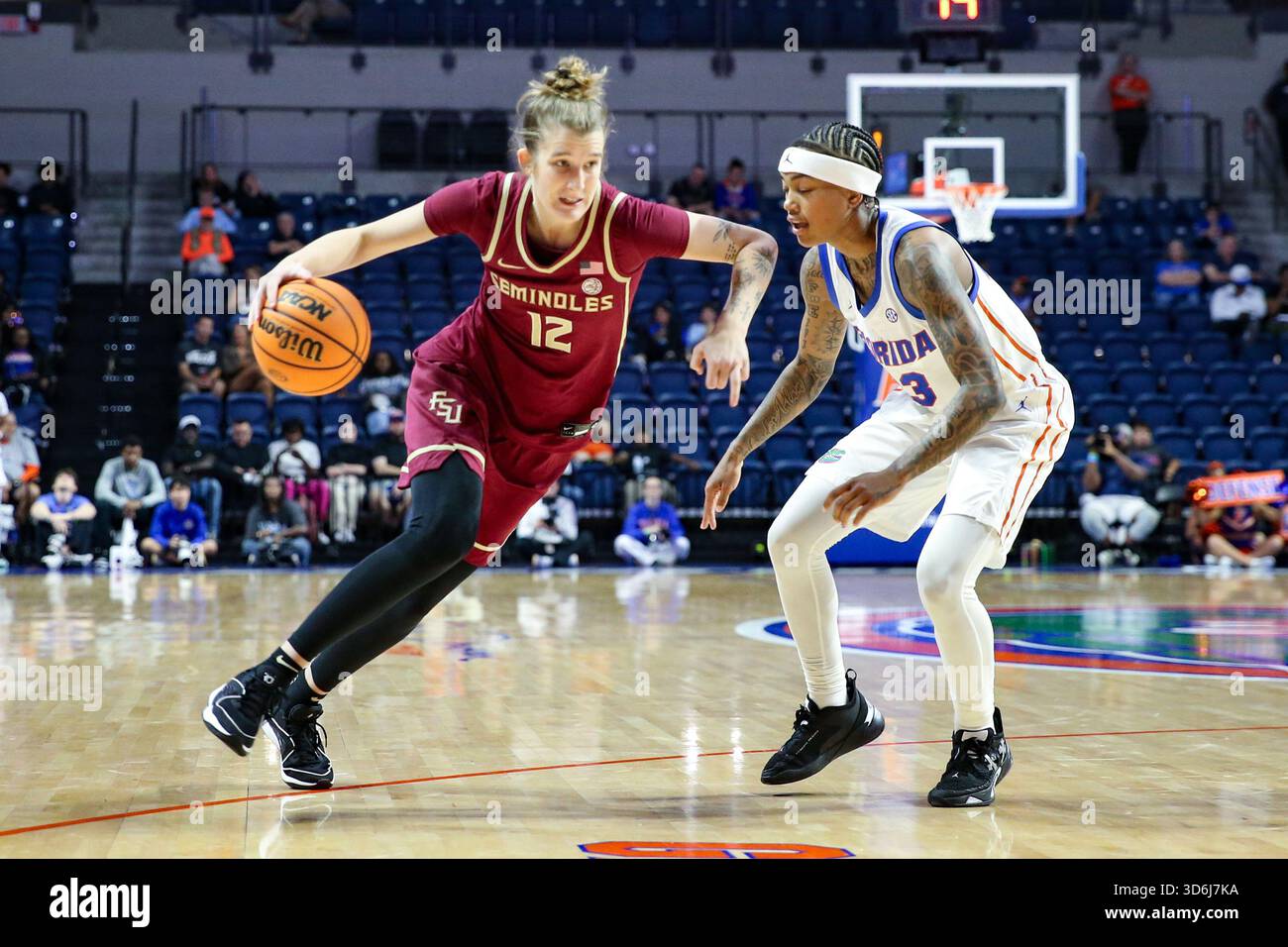 Florida State guard Emma Risch (12) drives toward the basket defended ...