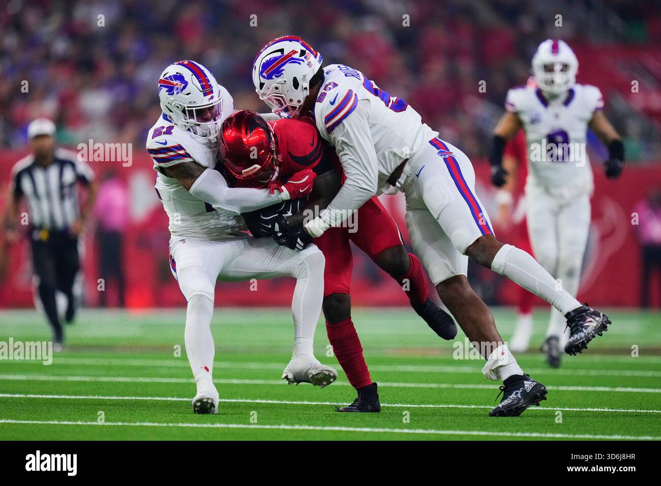 Houston Texans running back Woody Marks (27) is tackled after a run by ...