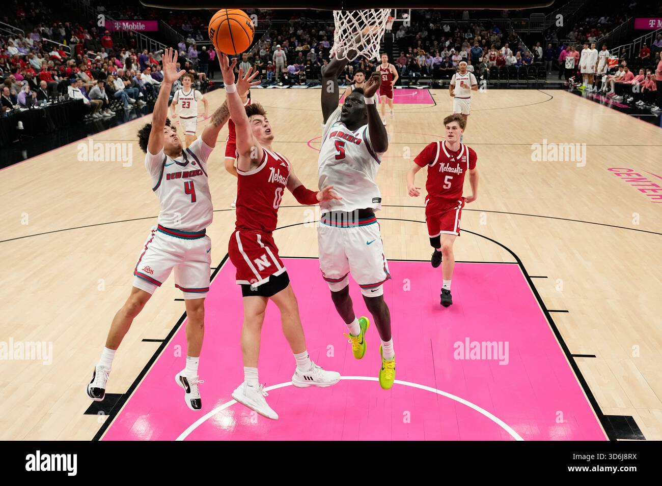 Nebraska guard Connor Essegian (0) shoots between New Mexico guard ...