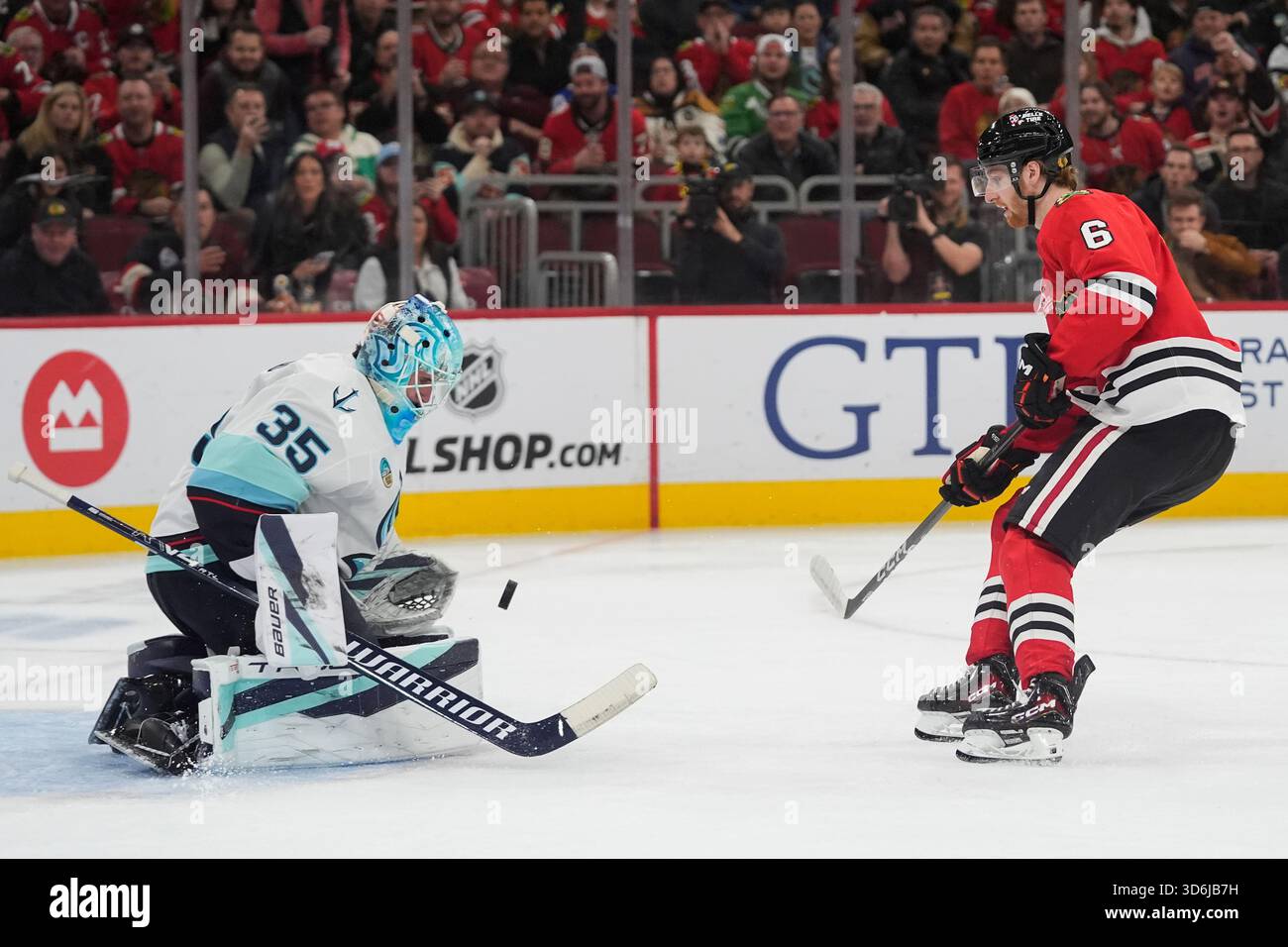 Seattle Kraken goaltender Joey Daccord (35) makes a save on Chicago ...