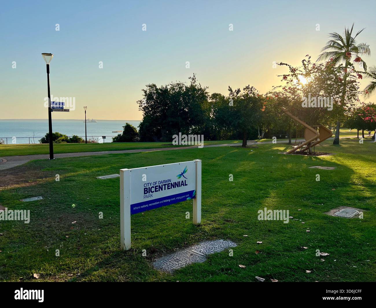 02 August 2024, Australia, Darwin: The sun sets over Bicentennial Park ...