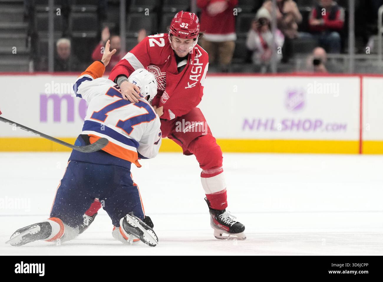 Detroit Red Wings center Marco Kasper, top, fights New York Islanders ...