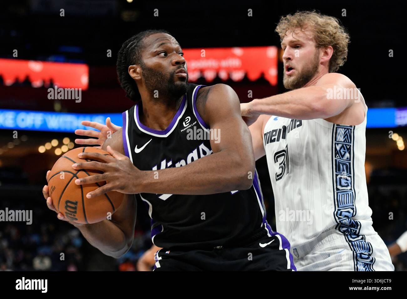 Sacramento Kings forward Precious Achiuwa, left, handles the ball ...