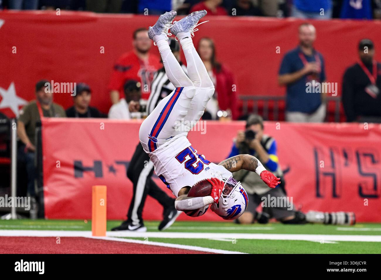 Buffalo Bills running back Ray Davis (22) flips as he scores a ...
