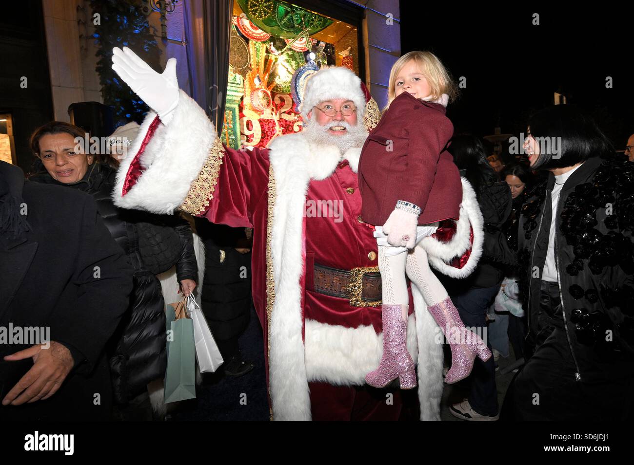 Santa Clause (character) holds four and half year-old Scout Spooner as ...