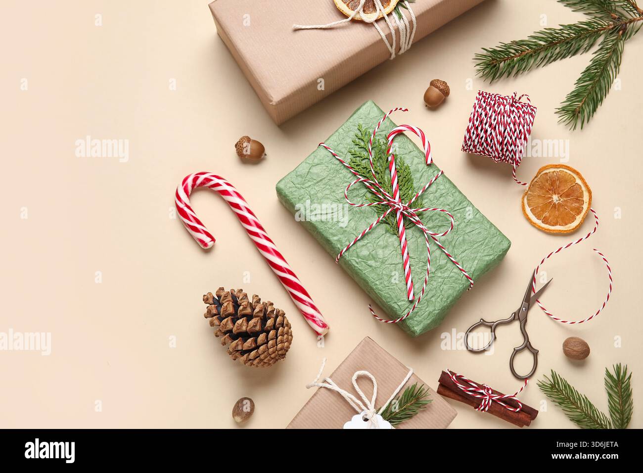 Gift boxes wrapped in eco paper with Christmas decorations, dried ...