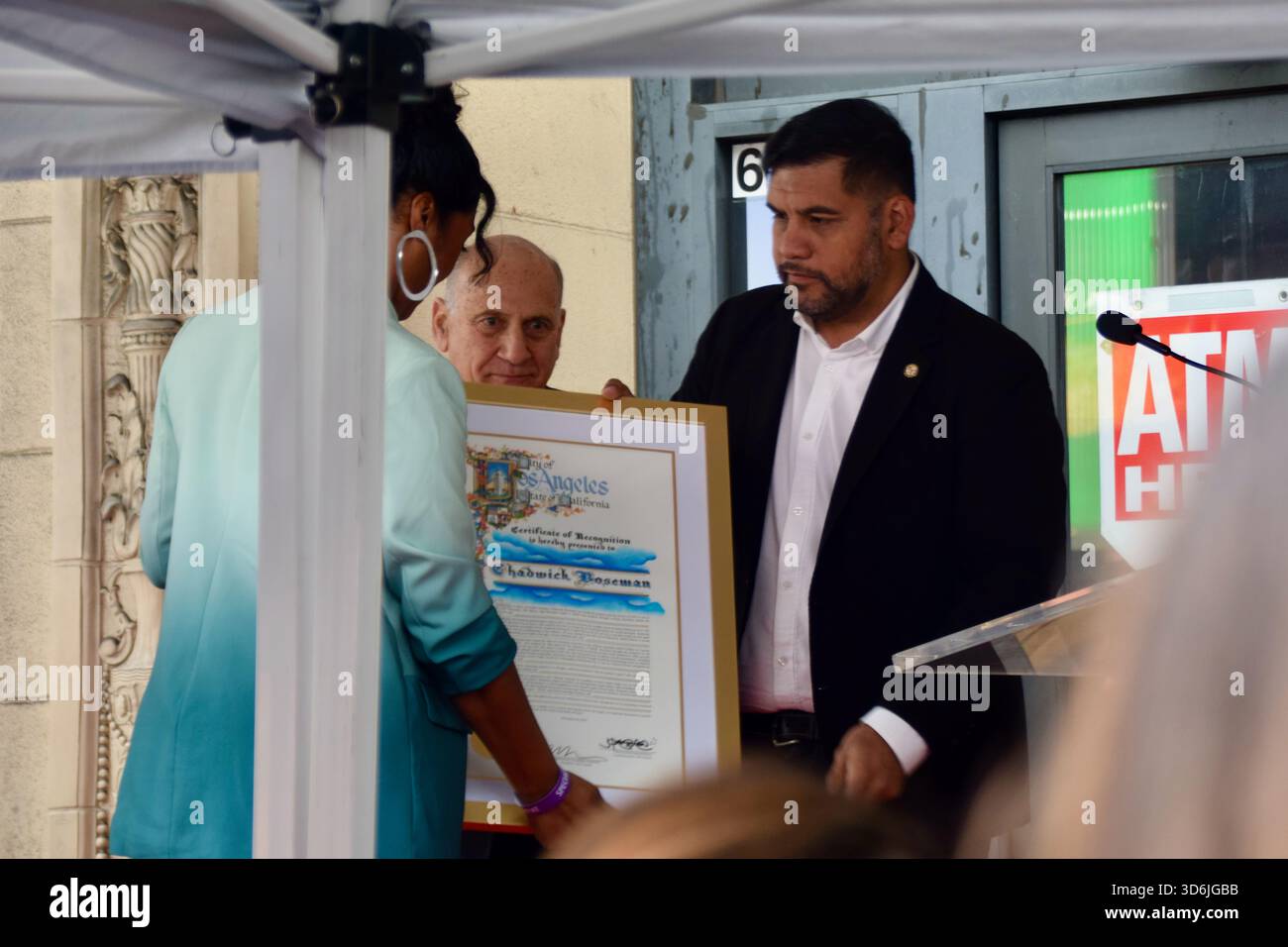 Councilmember Hugo Soto-Martínez presents a proclamation to Simone ...