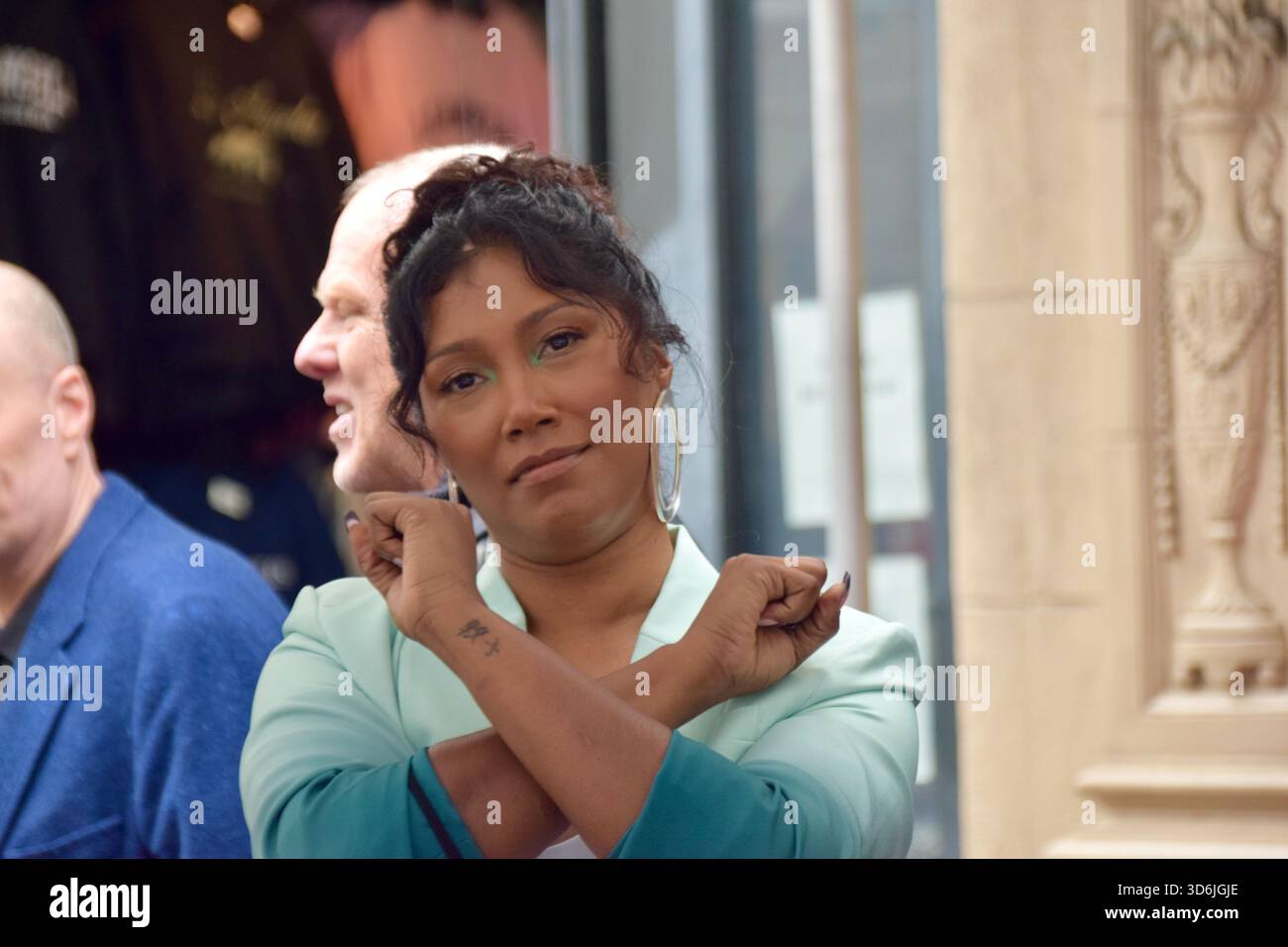 Simone Ledward-Boseman poses with her arms crossed in a Wakanda Forever ...