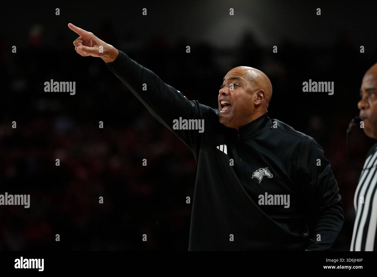 Rider head coach Kevin Baggett calls to his team during the first half ...
