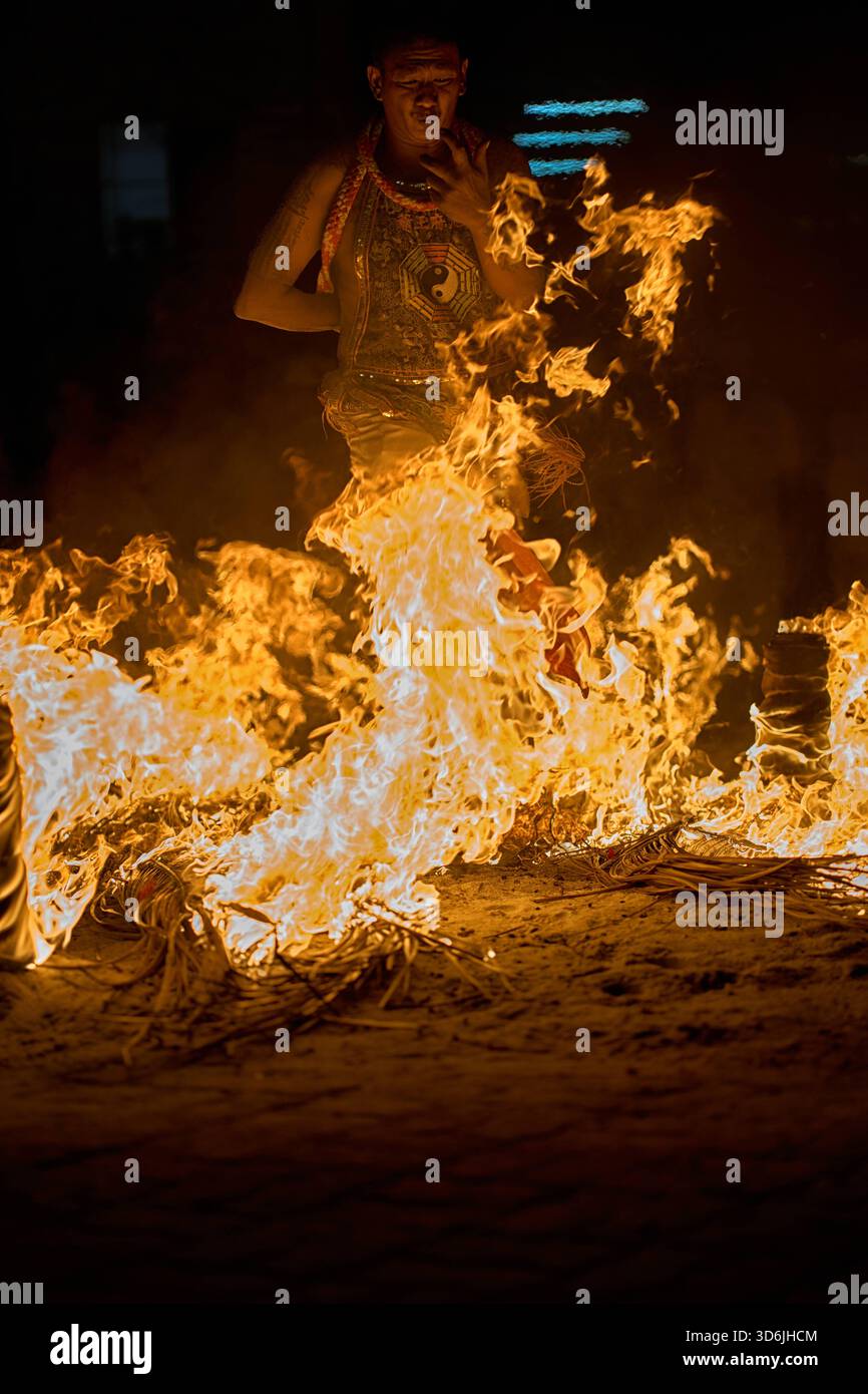 Malaysia. Kuala Lumpur. Chinese religion & culture. Man. Fire. Burn ...