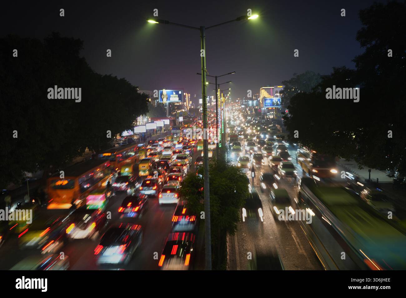 Traffic moves on a smog covered evening in New Delhi, India, Tuesday ...