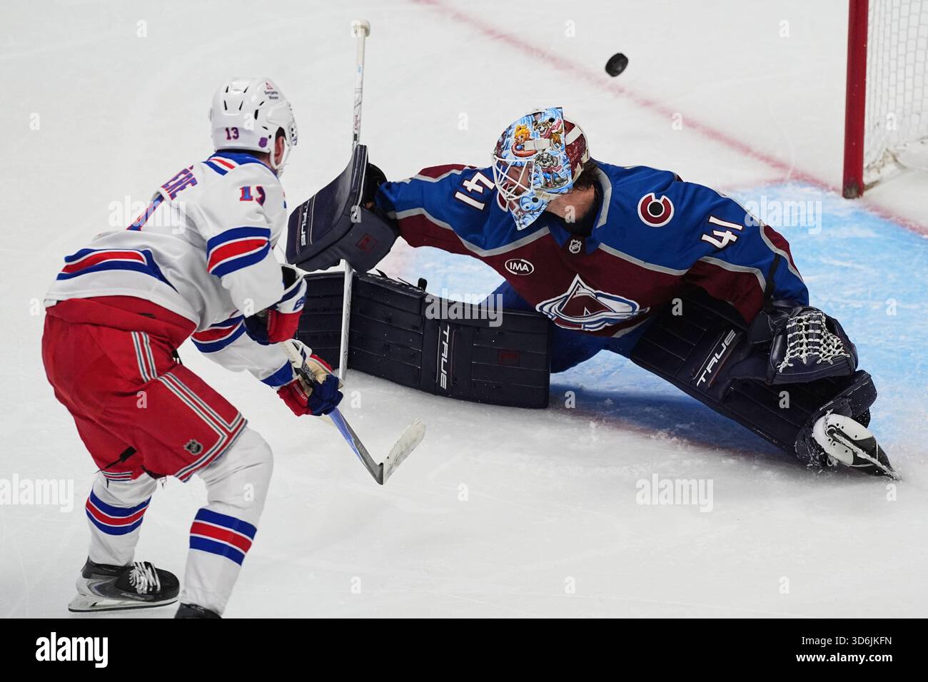 Colorado Avalanche goaltender Scott Wedgewood, right, deflects a shot ...