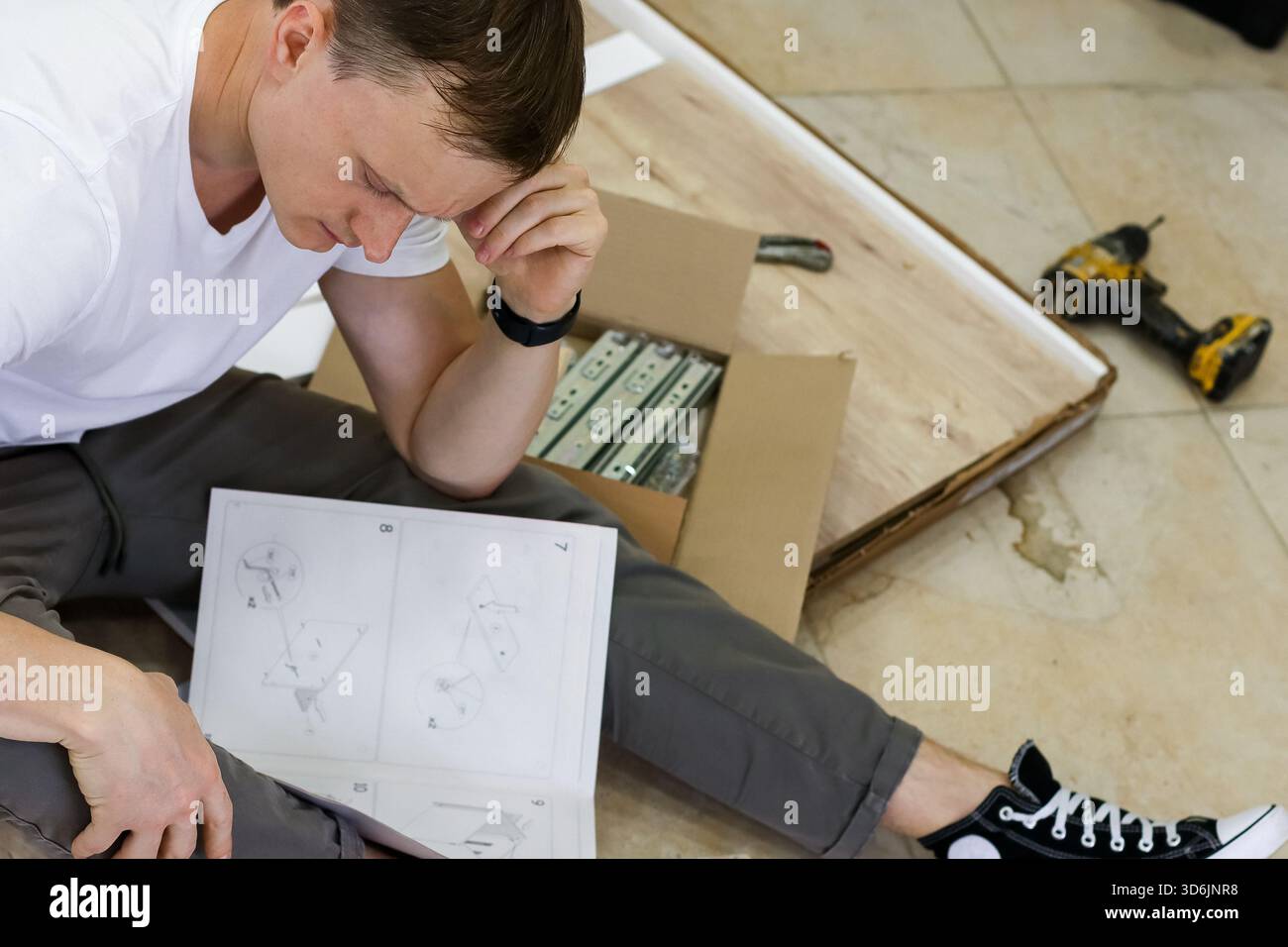 Young man unpacking parts hi-res stock photography and images - Alamy