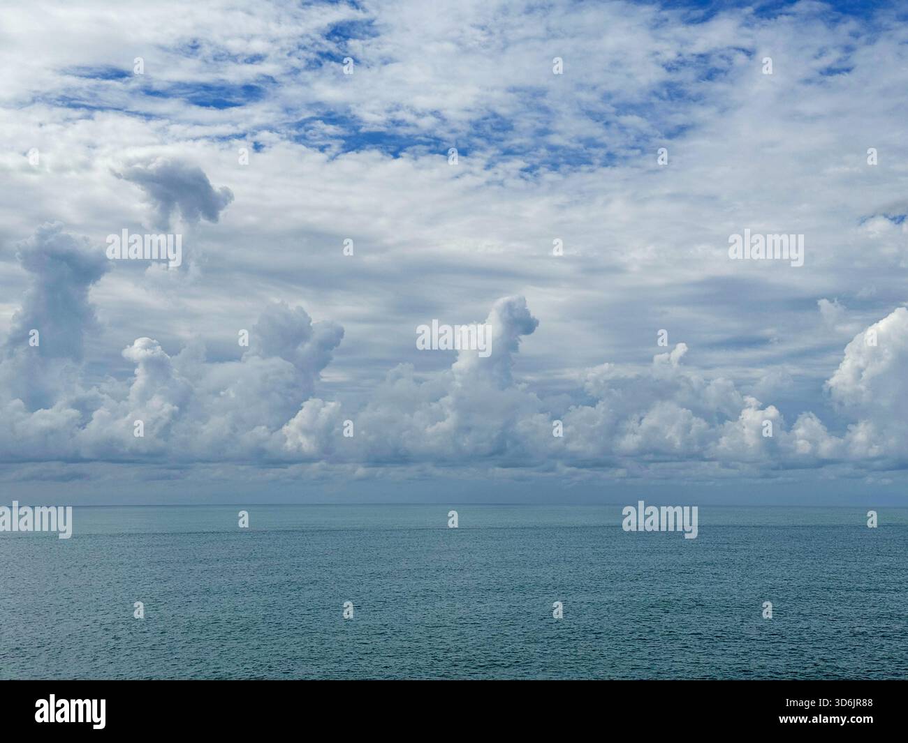 Beautiful clouds over ocean hi-res stock photography and images - Alamy