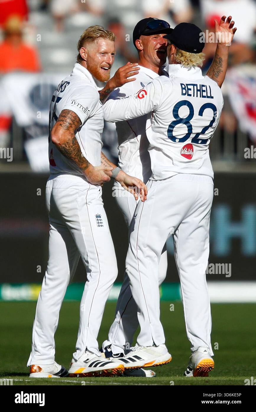 England's captain Ben Stokes, left, celebrates with teammates the ...