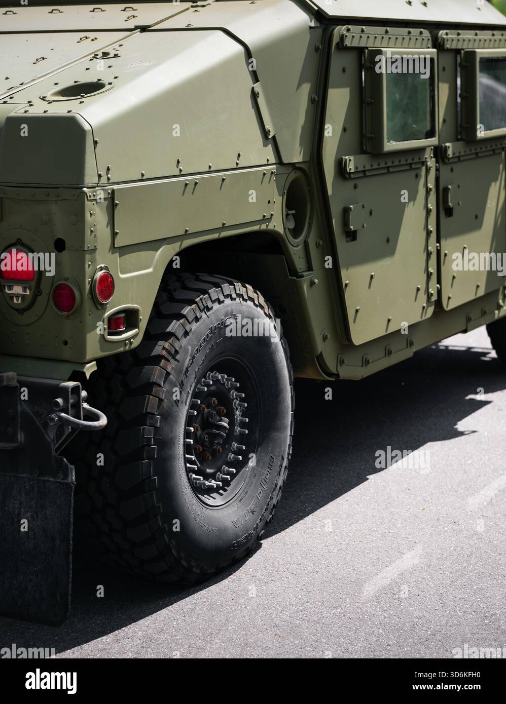 Close-up rear quarter view of a military Humvee truck. Olive drab green ...