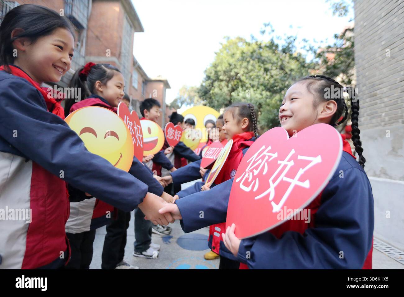 Pupils show greetings cards they made to celebrate the World Hello Day ...