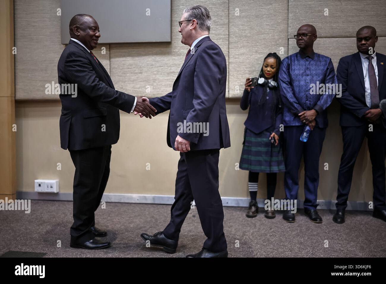 Prime Minister Sir Keir Starmer is greeted by South Africa's President ...