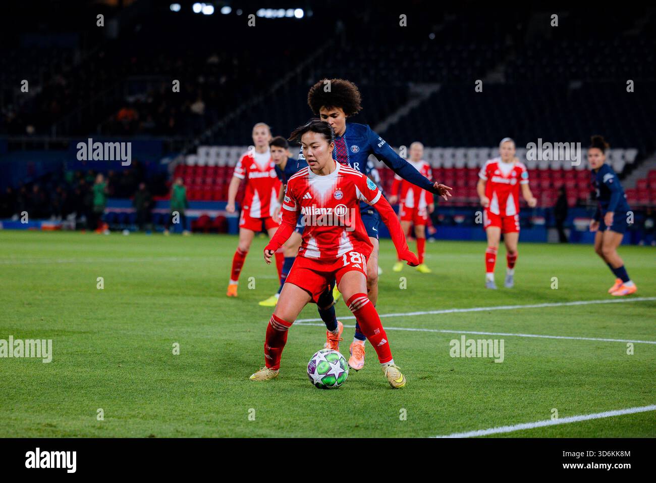 Momoko Tanikawa of Bayern Munchen is challengeg by Yaya (8 Paris Saint ...
