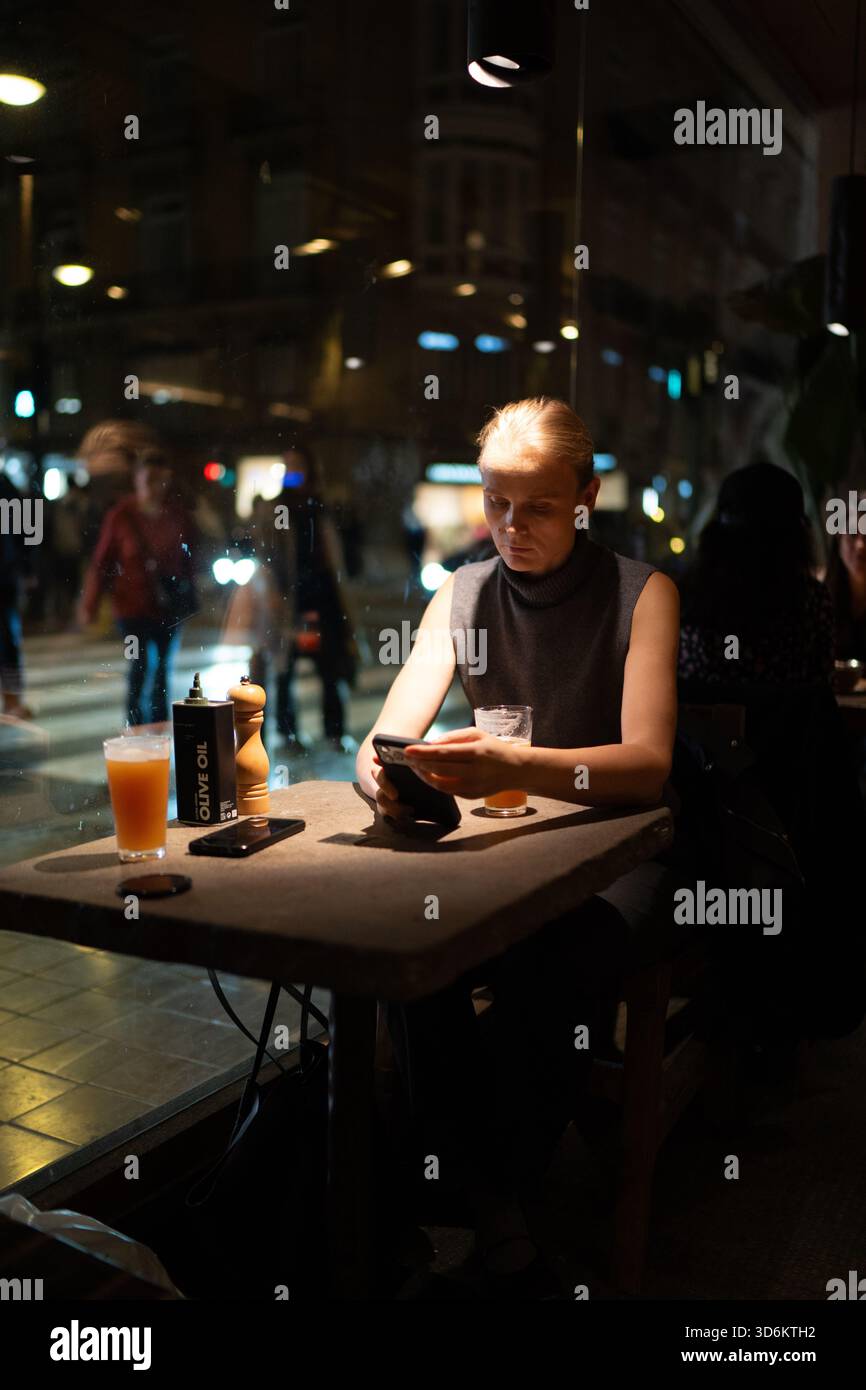 Woman seated in cafe hi-res stock photography and images - Alamy