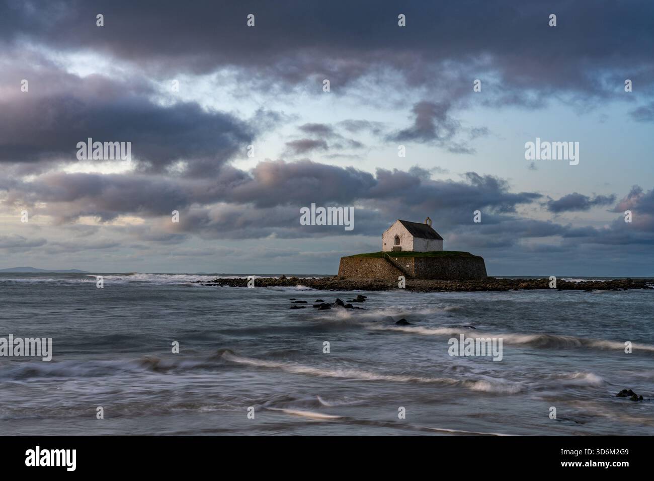 Tidal island church at St Cwyfan’s on Cribinau Stock Photo - Alamy