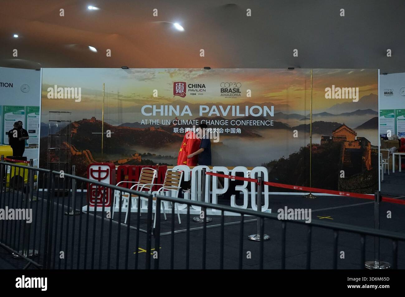 People clean up at the closed China Pavilion at the COP30 U.N. Climate ...