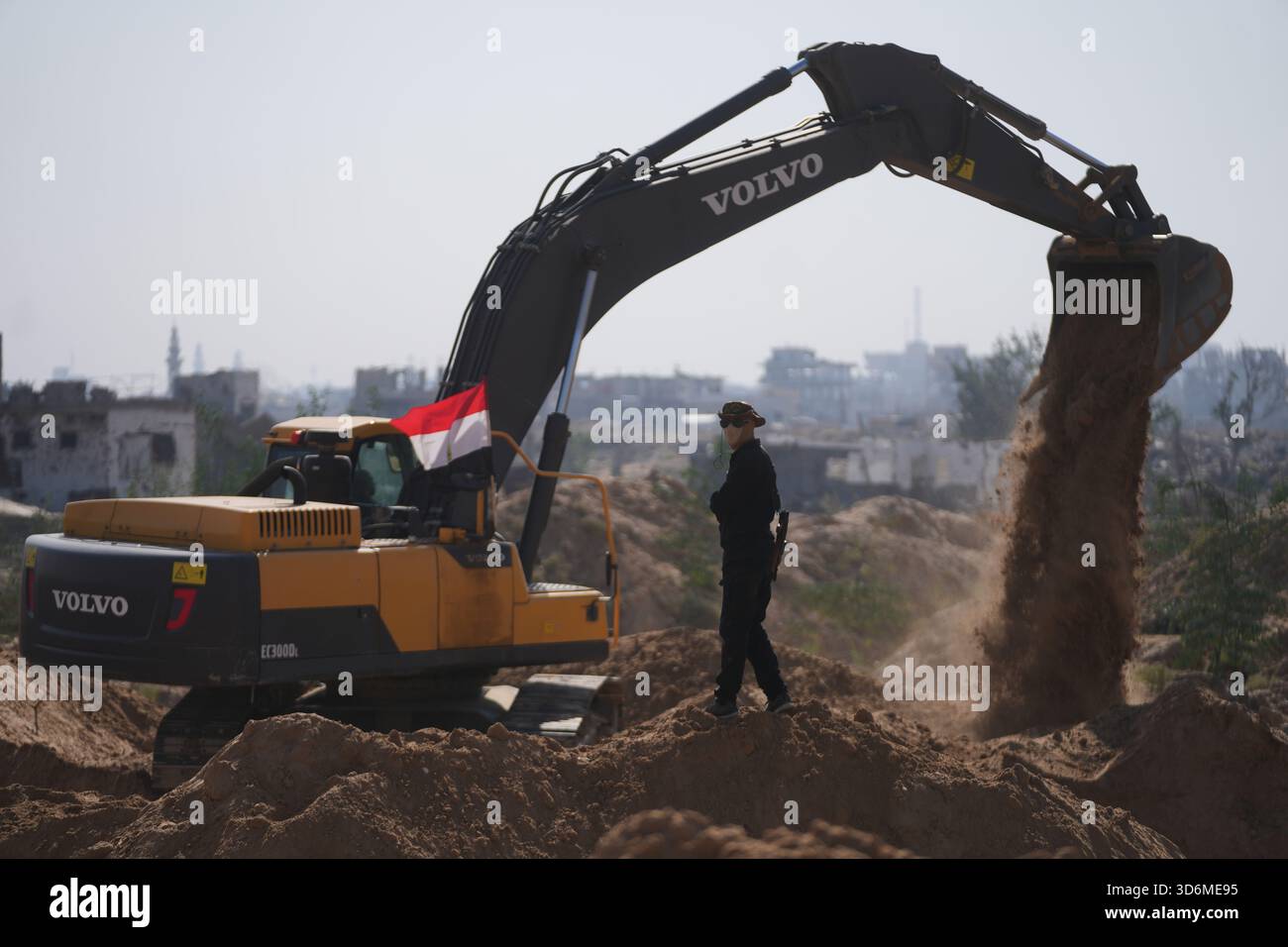 Islamic Jihad militants and Egyptian workers search for the bodies of ...