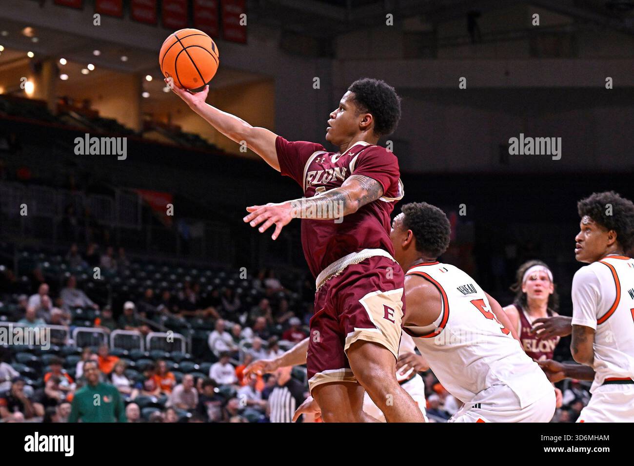CORAL GABLES, FL - NOVEMBER 20: Elon guard Ja'Juan Carr (3) puts up a ...