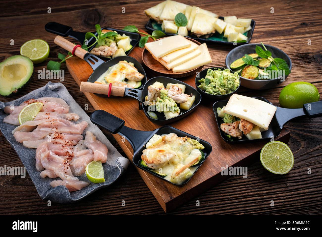 traditional authentic swiss raclette with chicken filet meat, pineapple ...
