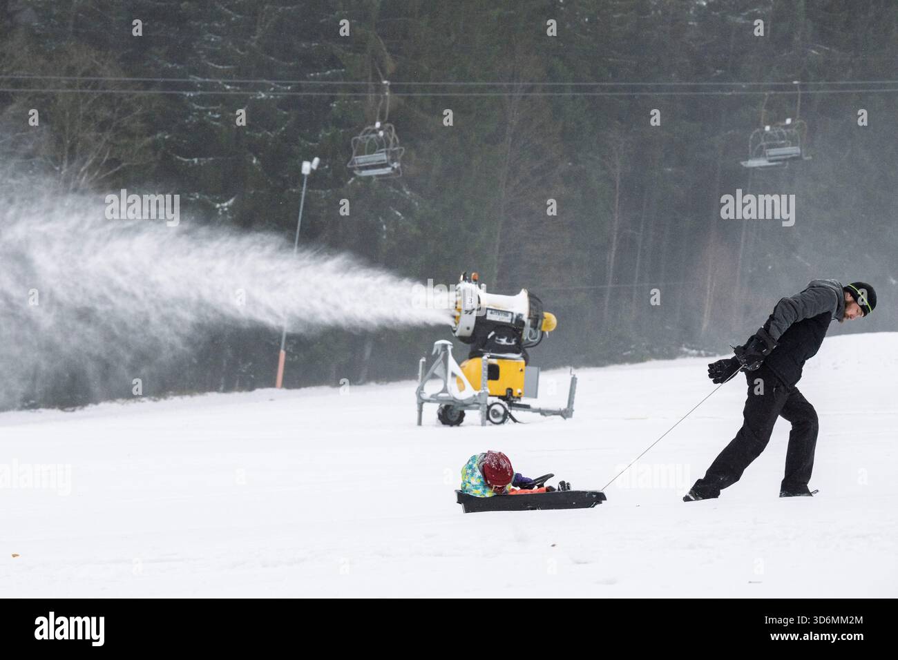 Snowmaking on ski slopes with snow cannons in Zadov in Sumava (Bohemian ...